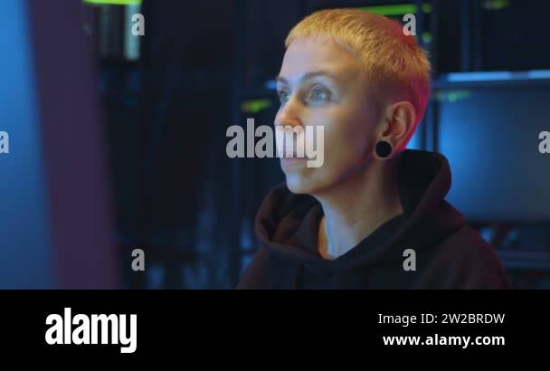 Portrait of Caucasian woman with short blond hair working in cyber ...