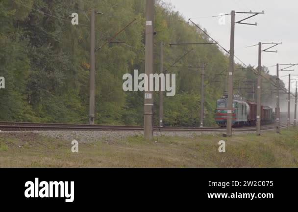 The movement of a freight train, a passing train leaves behind a lot of ...