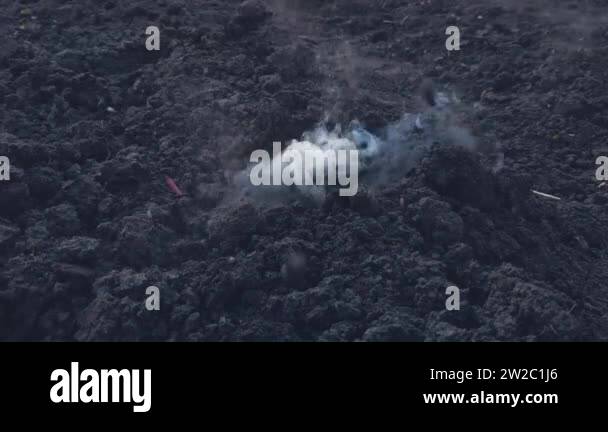 Explosion on the surface of the earth from an explosive device, hit by ...