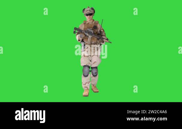 US Army soldier in combat uniform walking on a Green Screen, Chroma Key ...