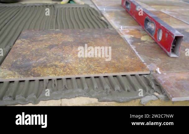 Laying ceramic tiles Stock Videos & Footage - HD and 4K Video Clips - Alamy