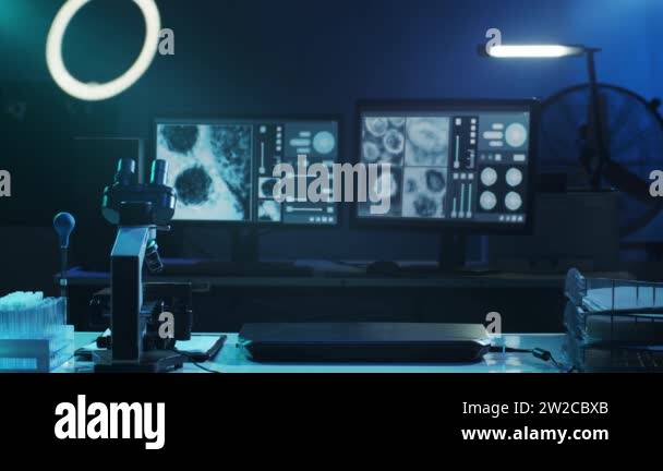 Scientist in protection suit and masks working in research lab using ...