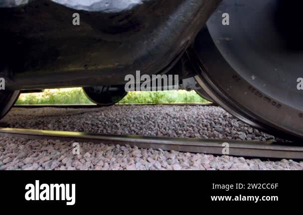 Closeup 4k dolly video of industrial railroad and big metal wheels on ...
