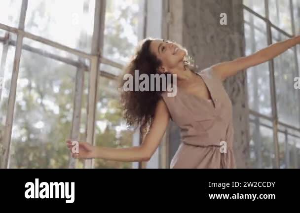 Woman with long hair dancing modern dance. Contemporary freestyle ...