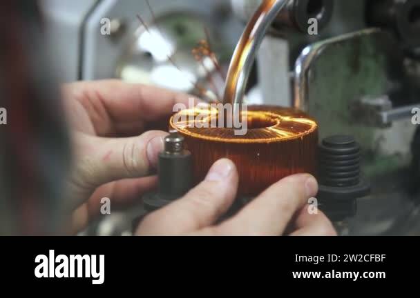 The hands of a specialist controls the production process of the ...