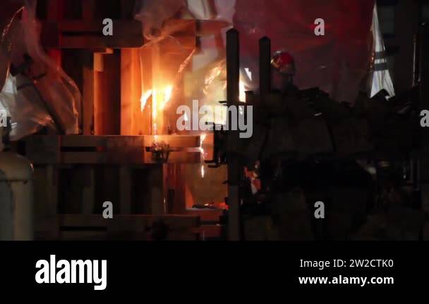 Fireman putting out small fire with his hands Stock Video Footage - Alamy