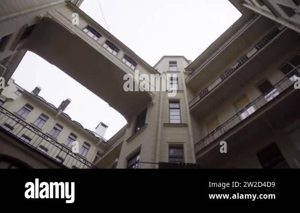 Bottom view of beautiful courtyard of residential building. Journey ...