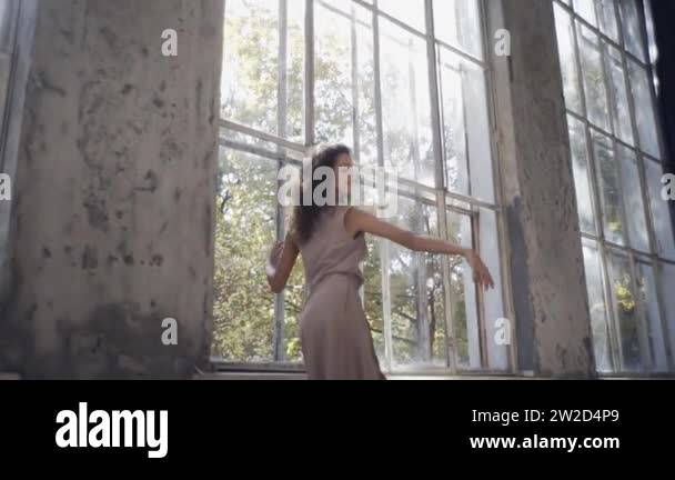 Woman with long hair dancing modern dance. Contemporary freestyle ...