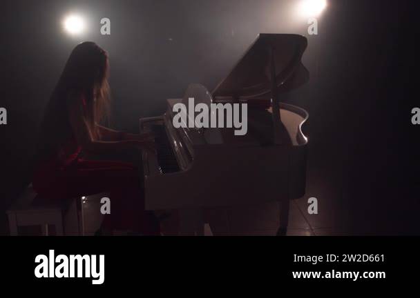 4K Footage Of Female Pianist Plays In Beautiful Grand Piano On Stage In ...