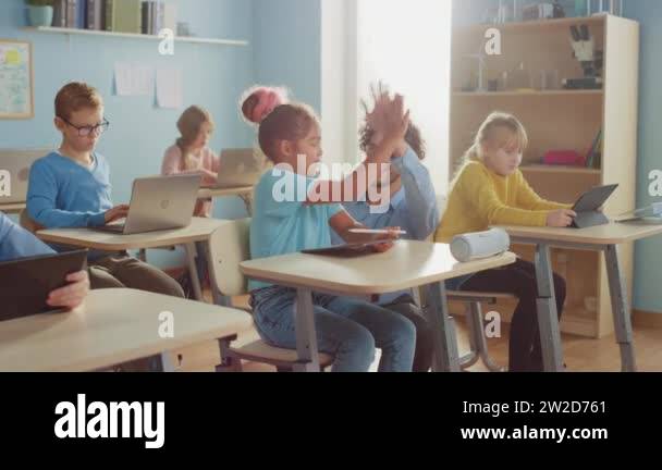Elementary School Computer Science Class: Smart Boy Uses Laptop ... Elementary School Computer Science Class: Smart Boy Uses Laptop ...