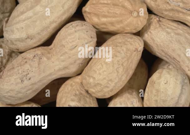Rotation of peanuts close-up. Peanuts are unpeeled in the skin Stock ...