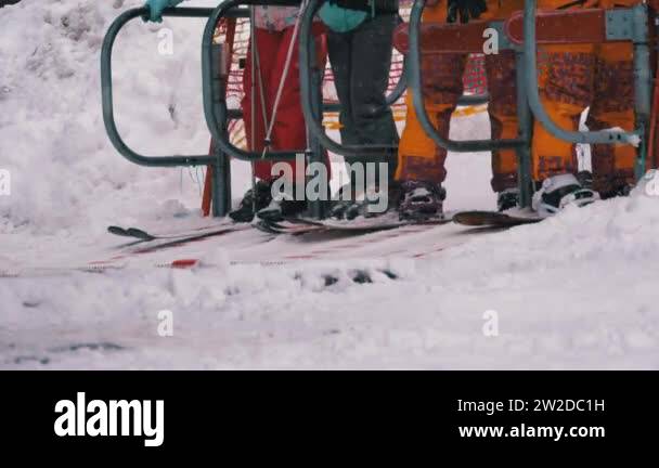 Skiers Pass a Turnstile Gates of Ski Lift. The Entrance of a Ski Chair ...