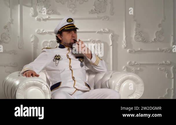 A video from the various actions of the sea captain in white uniform ...