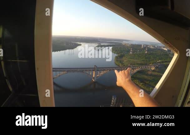 Incredible areal view of the terrain with a high construction crane, a ...