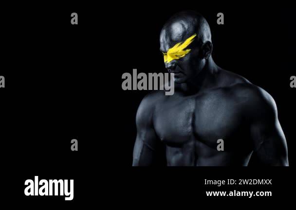 Man sports fan and bodybuilder athlete with yellow color on face art ...