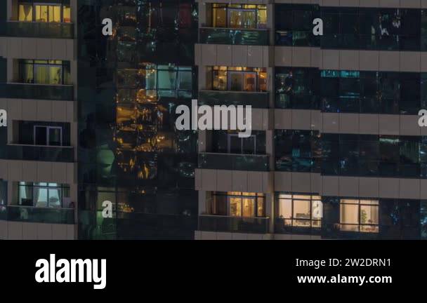 Night view of exterior apartment building timelapse. High rise ...
