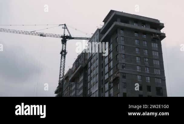 Construction site with high crane. Builders build modern residential ...