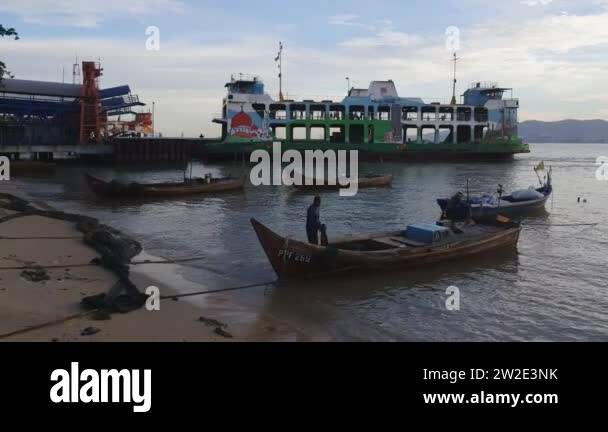 Butterworth, Penang/Malaysia-Jun 02 2018: Fisherman at the traditional fishing boat with modern ...