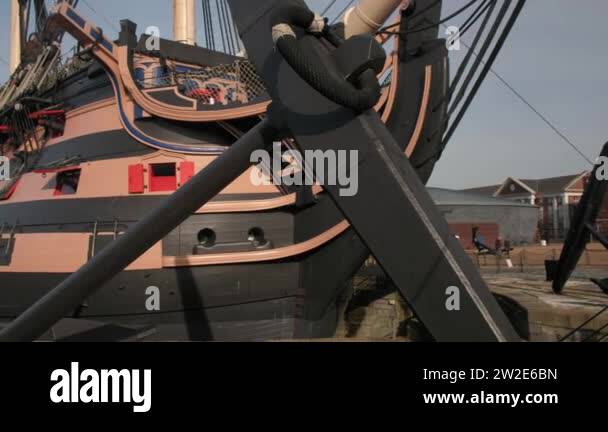 Pan along the hull of HMS Victory in Portsmouth Historic Dockyard. HMS ...