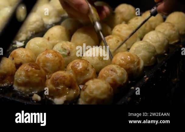 Japanese vendor prepare a Takoyaki on hot pan food Japan. Process to ...