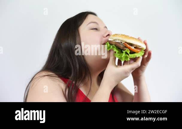Obese women are happy with eating hamburgers. Fat girl, junk food and ...