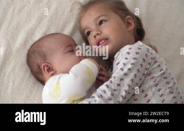 Childhood, infancy, family, sleep, rest concept - close up of two ...