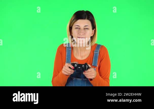 Girl playing a video game using a wireless controller with joy and wow ...