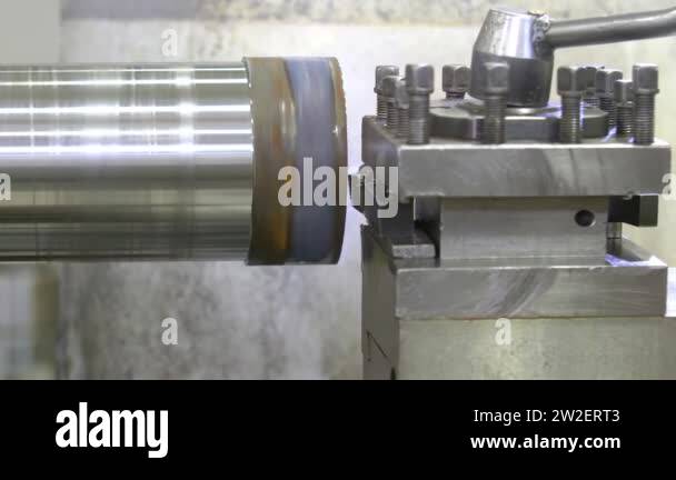 The lathe produces the metal part at the factory. Processing of the ...