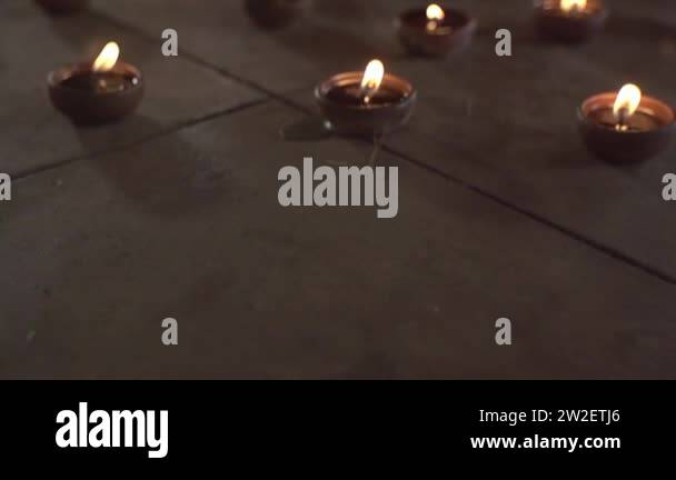 A monk in an ancient temple lights a sacred fire, the priestess brought ...