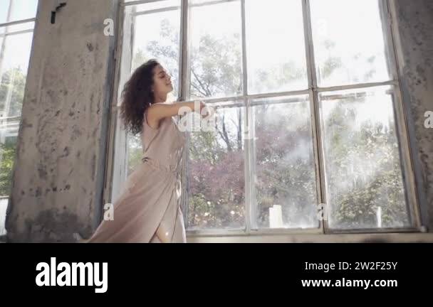 Woman with long hair dancing modern dance. Contemporary freestyle ...