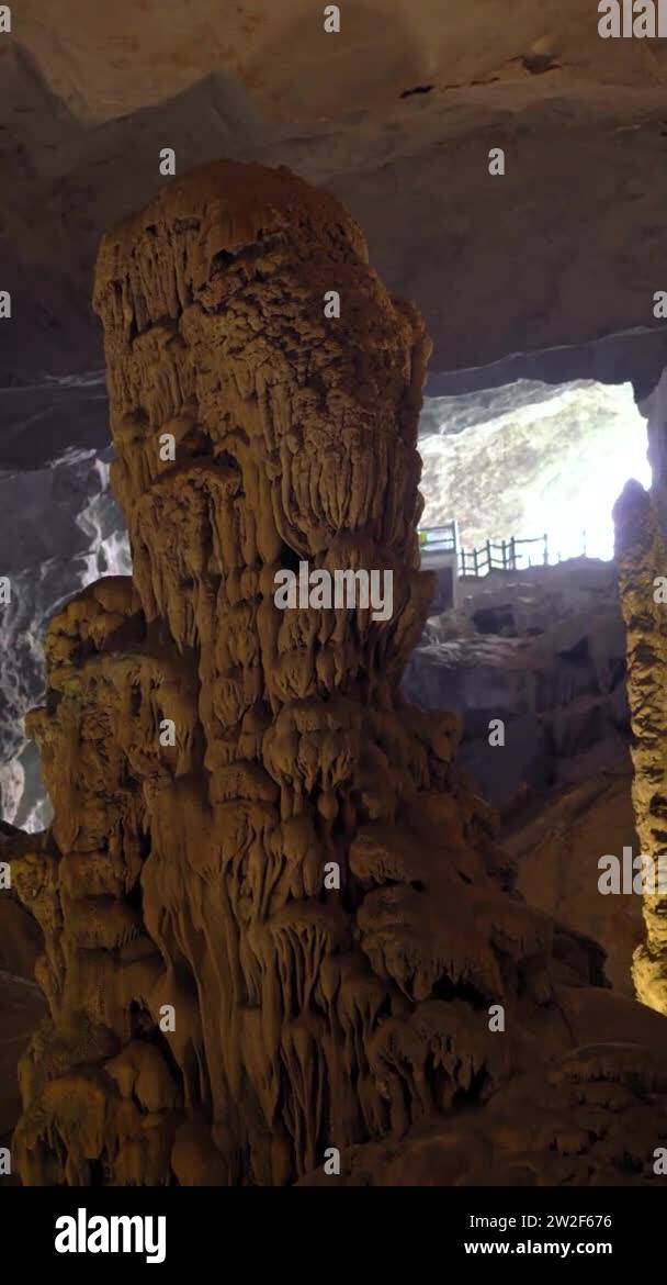 Vertical video. Stalactites inside of the biggest cave in the Halong ...