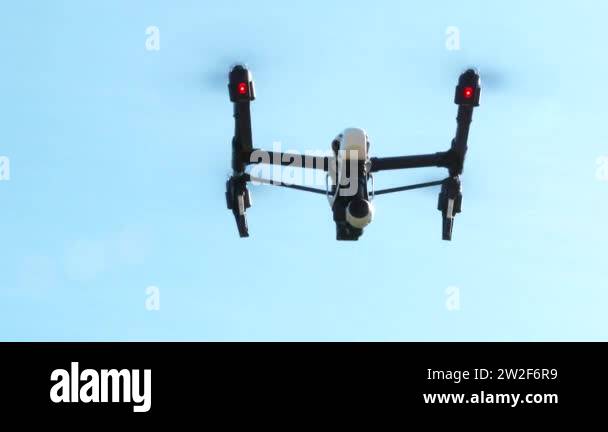 Large, professional unmanned aerial vehicle also known as a quadcopter ...