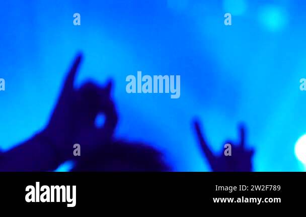 people dancing at a disco in a club waving hands showing different ...