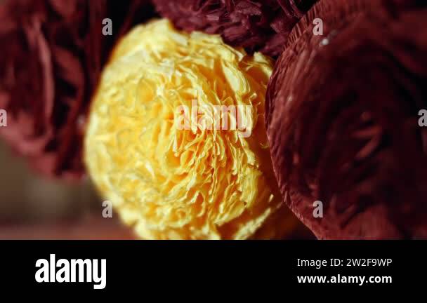 Close up of handmade colorful paper flowers, event preparation. Special ...