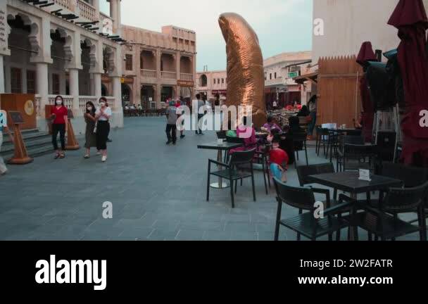 Souq Waqif in Doha, Qatar Main street at sunset showing Coffee shops ...