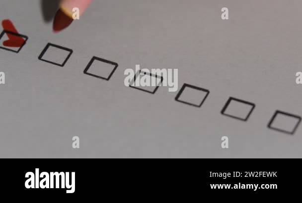 Person Ticks Checkbox Marks with a Pen, filling up To Do List. A person ...