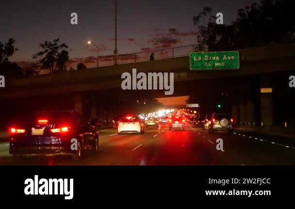 View from the car. Los Angeles busy freeway at night time. Massive ...
