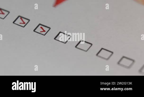 Person Ticks Checkbox Marks with a Pen, filling up To Do List. A person ...