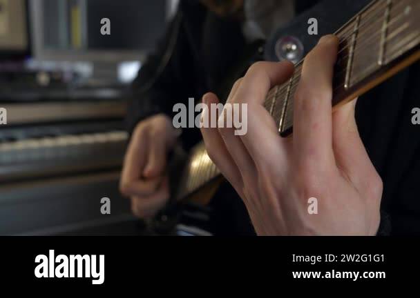 Fingers On Fretboard Strings. Close-up Hands Playing Music on Electric ...