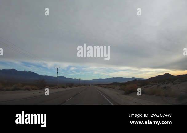 4K. POV view of car driving on highway in the California states. A car ...