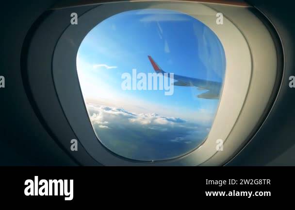 Fast motion of an aircraft flying seen through its window Stock Video ...