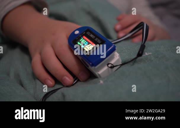 Europe, Kiev, Ukraine - November 2020: Children's hands measure oxygen ...