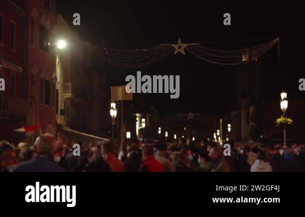 Crowd of angry people with sign and Italian flags on street Stock Video ...