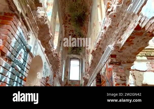 Linear tracking inside the mansion ruins. Red brick walls and empty ...