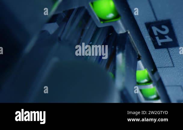 Macro Shot: Ethernet Cables Connected to Router Ports with Blinking Lights. RJ45 Internet ...