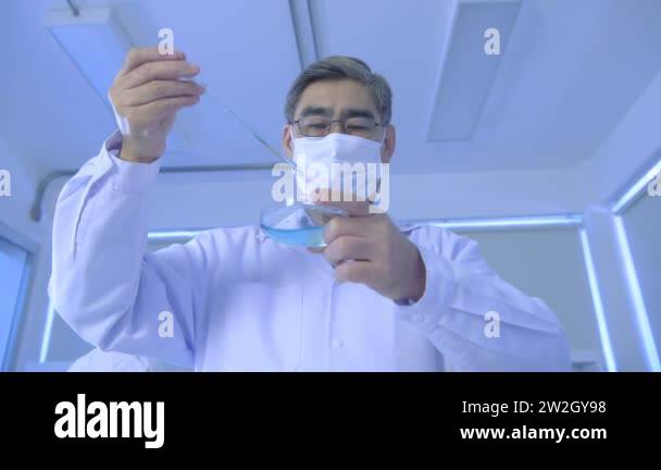 Research concept of 4k resolution. Asian scientists are dripping ...