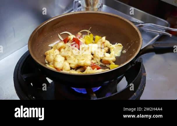 Chinese food. National food. Cook in a pan. Asian Street food. Chef ...