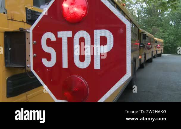 Bus stop sign with hazard lights on. (1 of 5 Stock Video Footage - Alamy