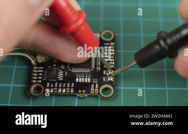 Electronic multimeter tool measuring voltage on ARM digital controller ...