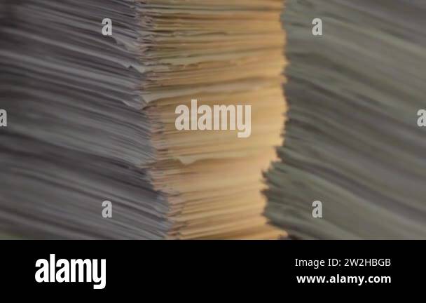 Old business documents are stored in a pile in the archive. Old ...